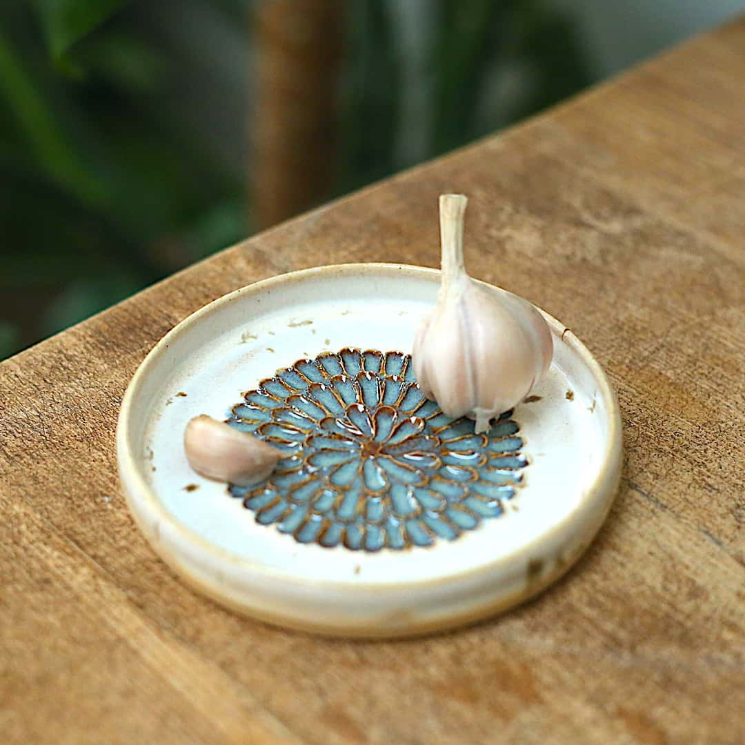 blue daisy garlic grater plate